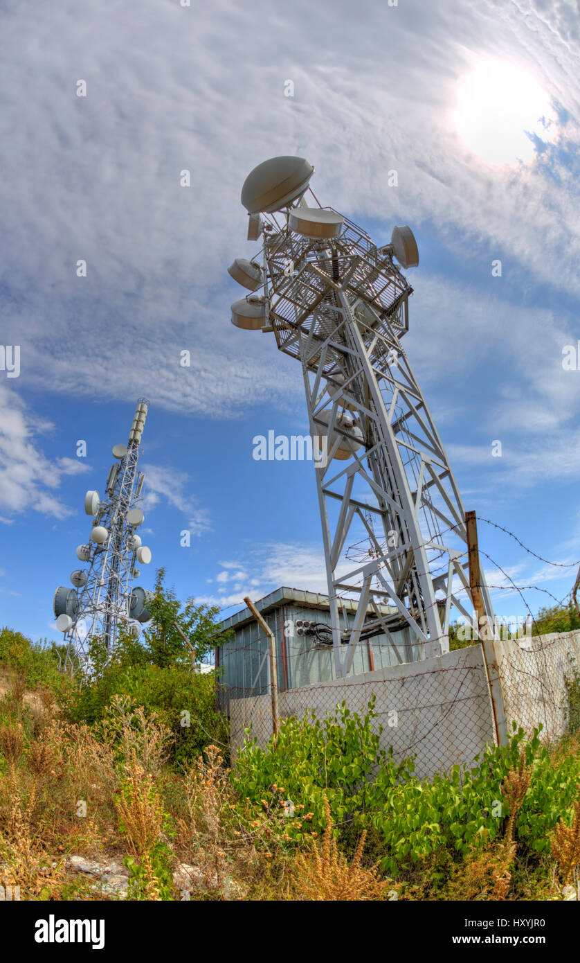 Communication antenna towers in fish-eye perspective Stock Photo - Alamy