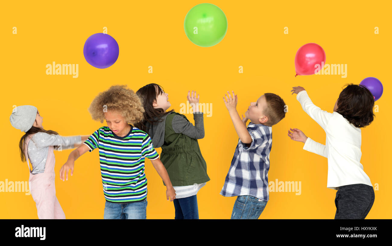 Children Smiling Happiness Playing Balloon Stock Photo - Alamy