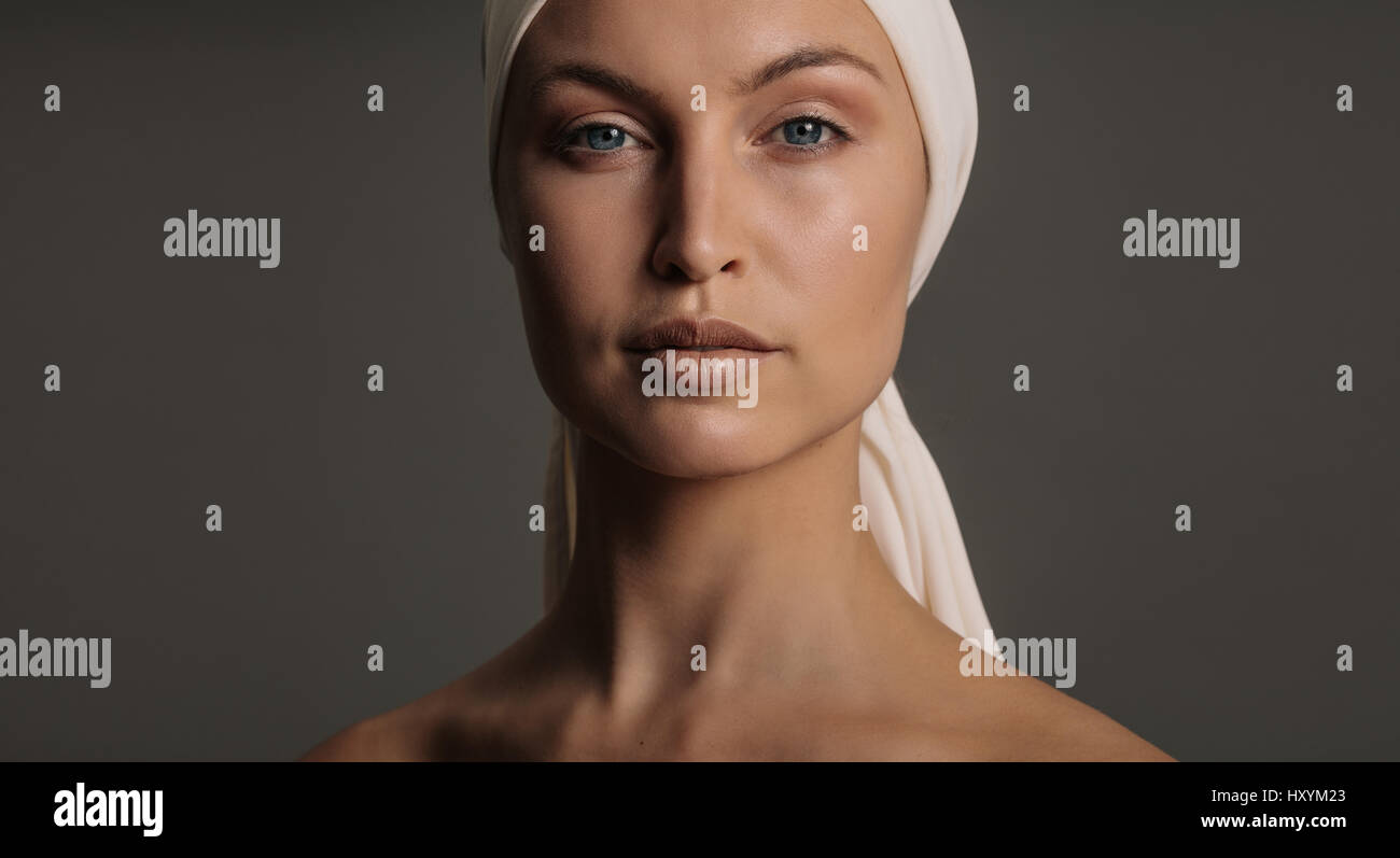 Close up of studio shot beautiful young woman with fresh clean skin ...