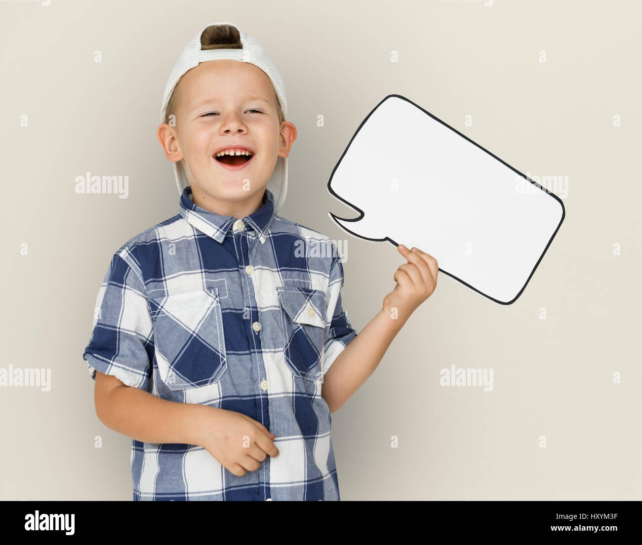 Caucasian Little Boy Holding Chatbox Papercraft Stock Photo - Alamy