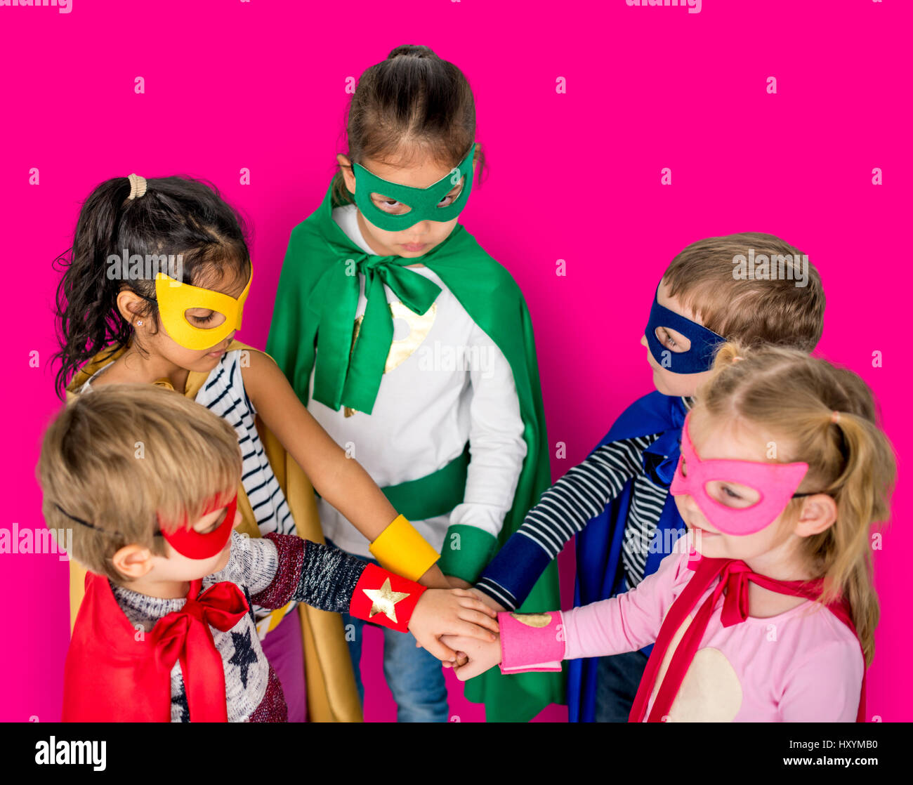 Little Kids Superhero Hands Together Teamwork Stock Photo - Alamy