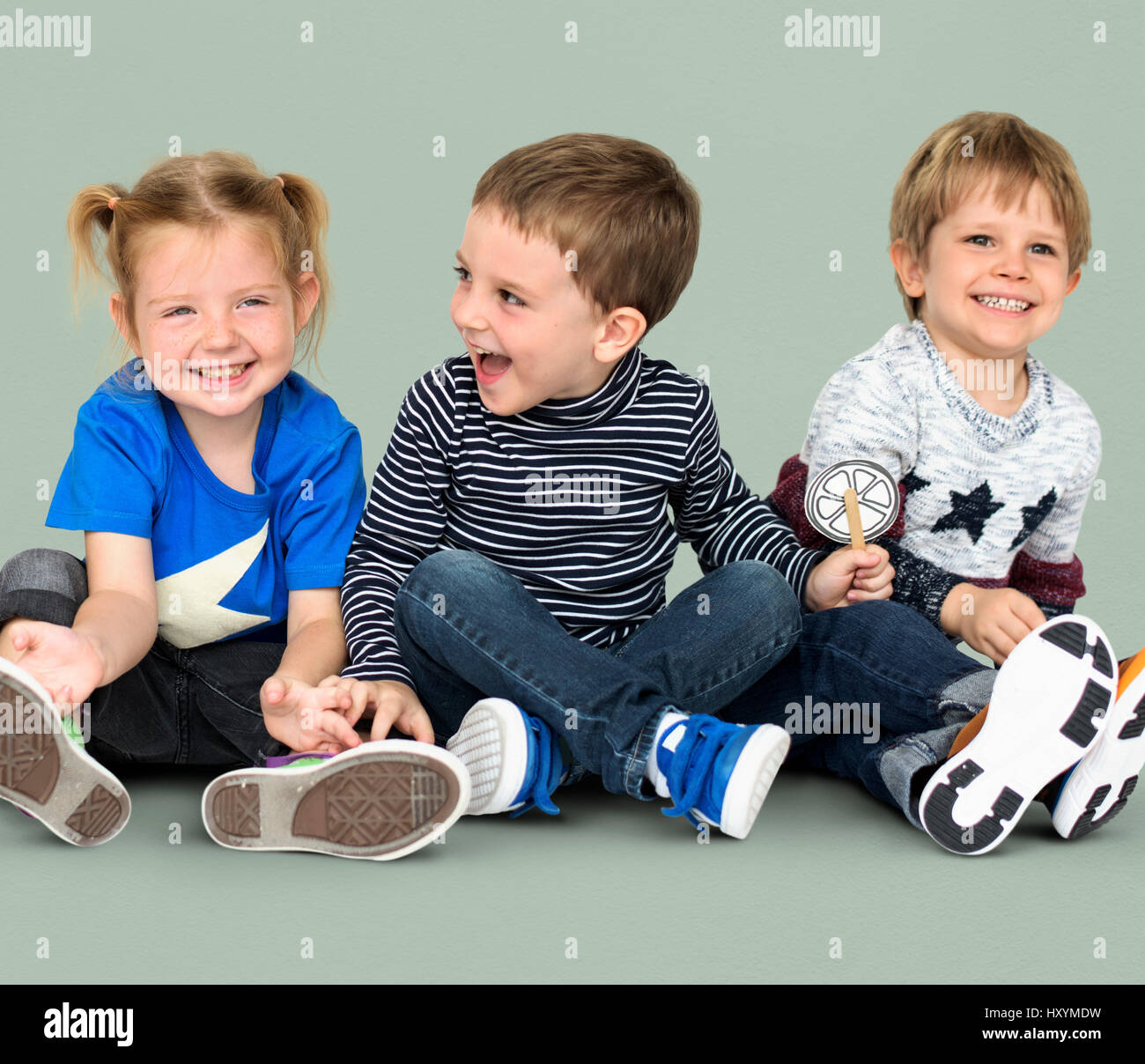 Little Children Holding Down Happy Cheerful Stock Photo - Alamy