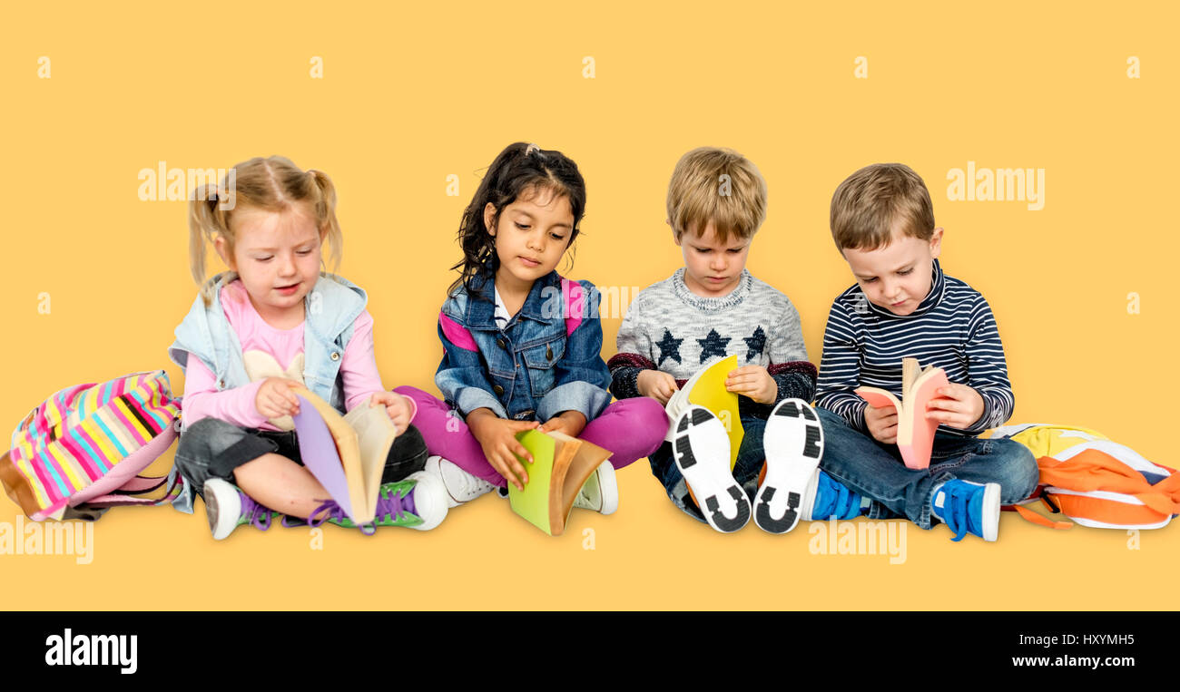 Little Children Reading Books Smiling Stock Photo - Alamy