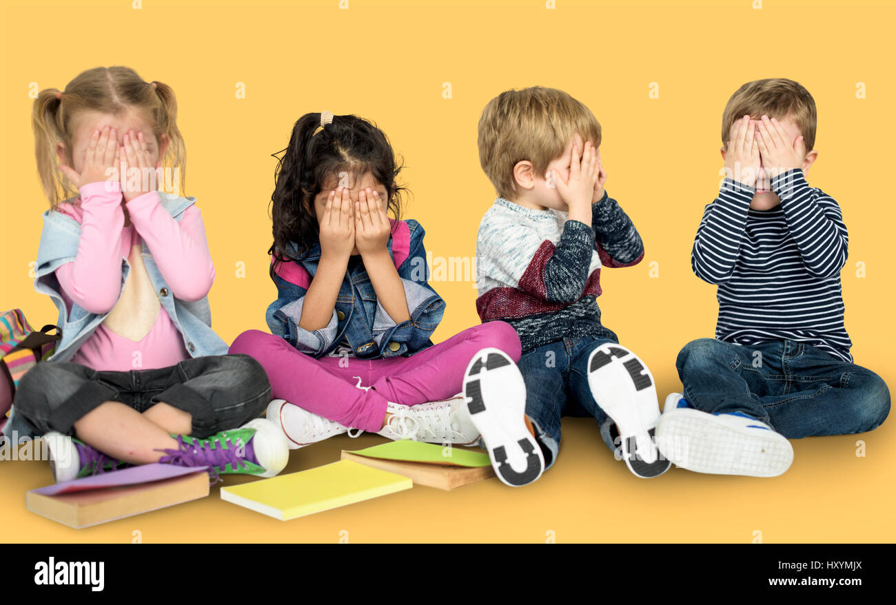 Little Children Peek-A-Boo Covering Face Stock Photo - Alamy