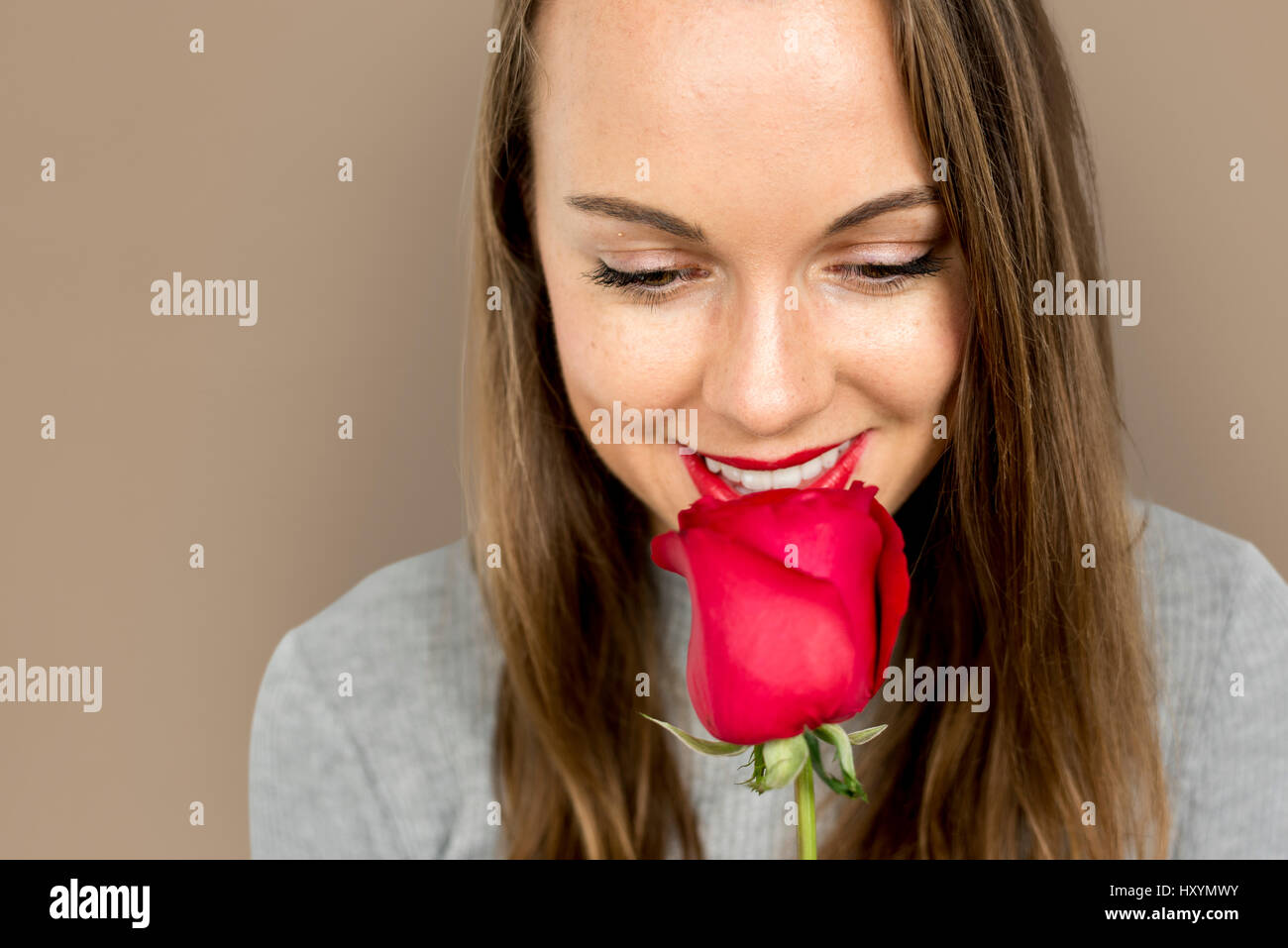 Young Lady Hugging Rose Smiling Stock Photo - Alamy