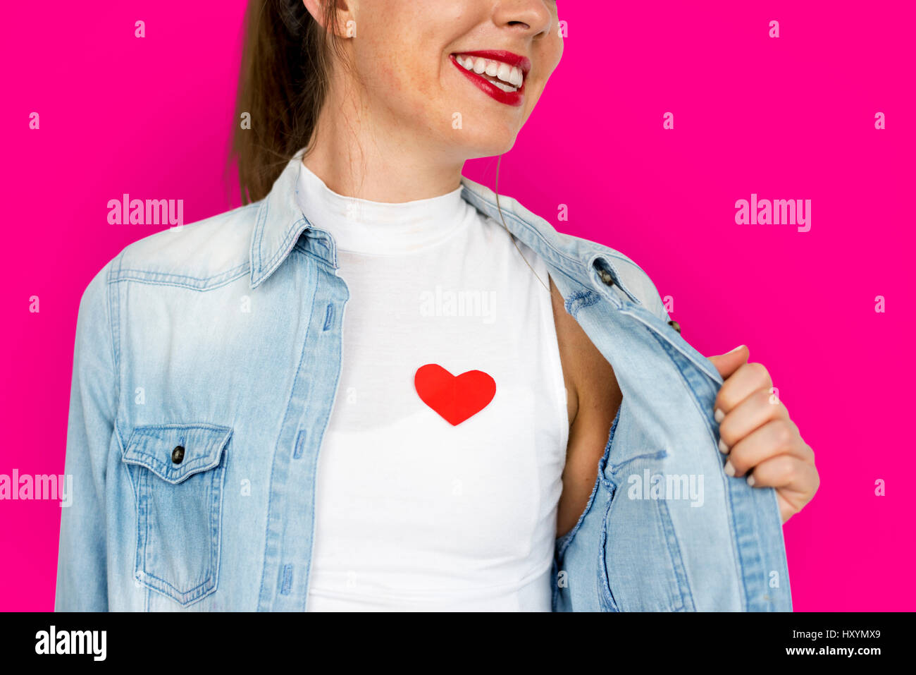 Young Lady Smiling Heart Chest Stock Photo - Alamy