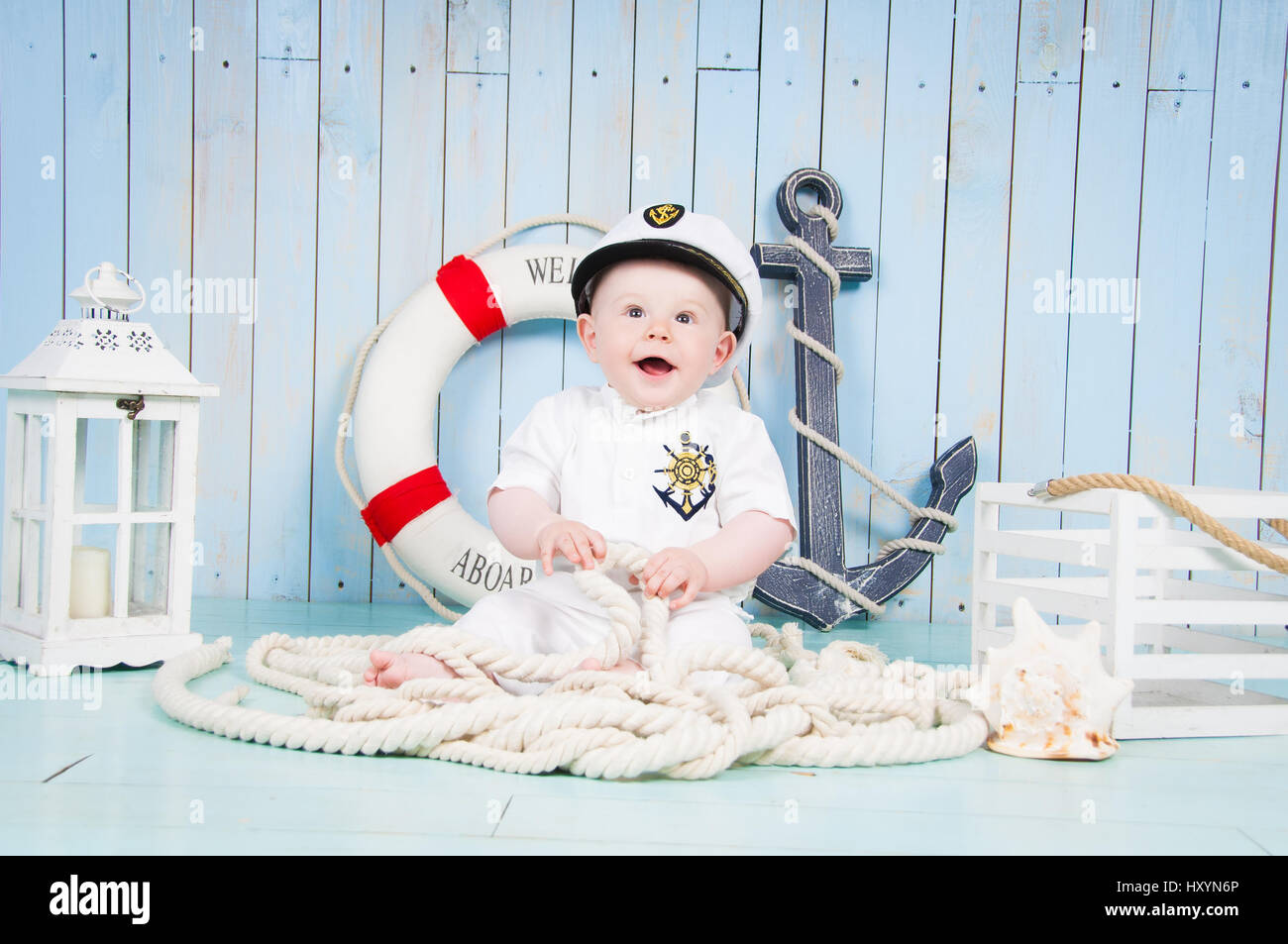 A small cheerful captain in a maritime interior Stock Photo - Alamy