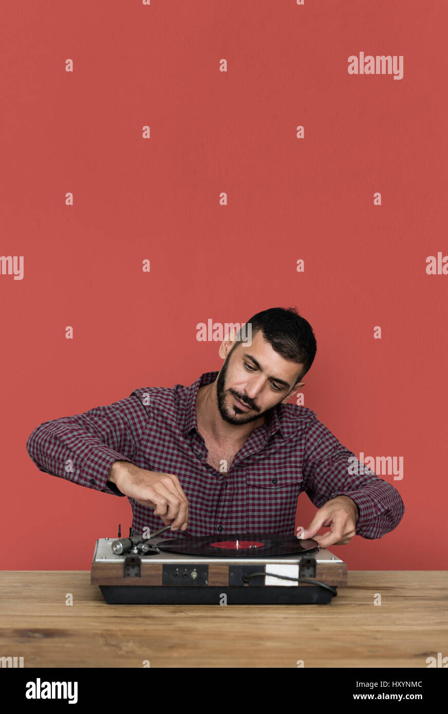A man playing music using vinyl record instruments Stock Photo - Alamy