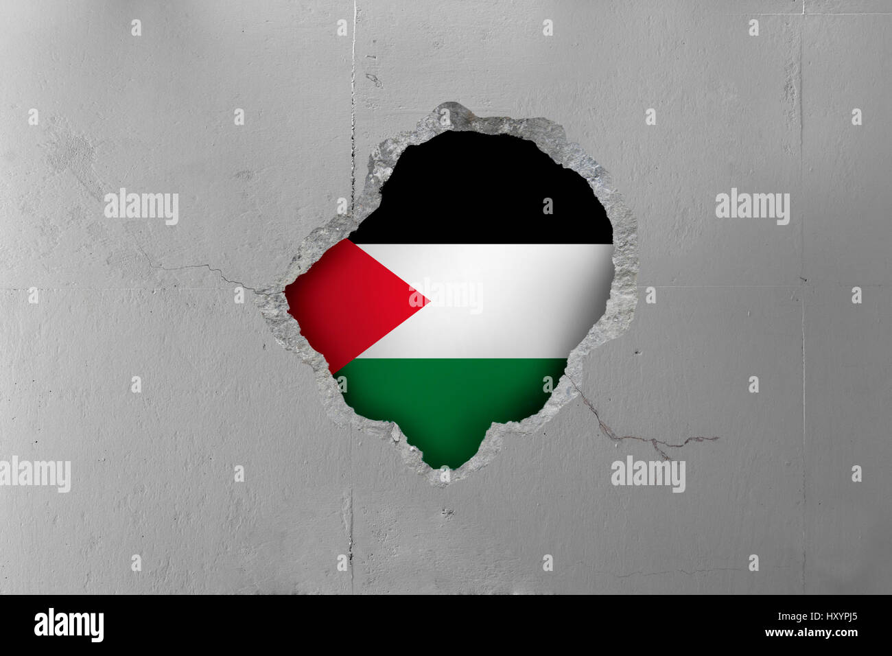 Palestinian flag behind a concrete wall Stock Photo - Alamy