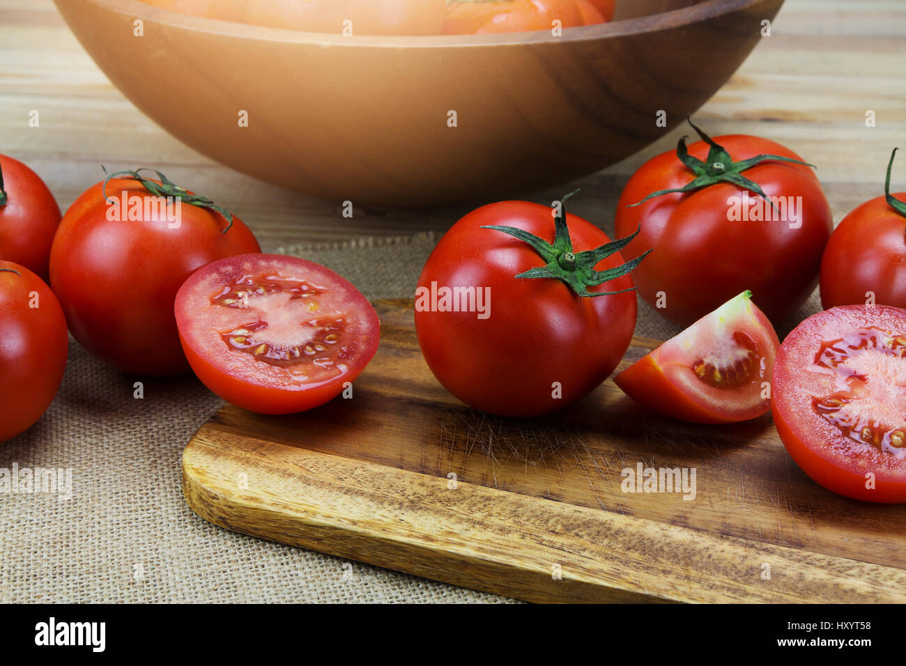 Closeup Fresh ripe tomatoes on wood background Stock Photo - Alamy