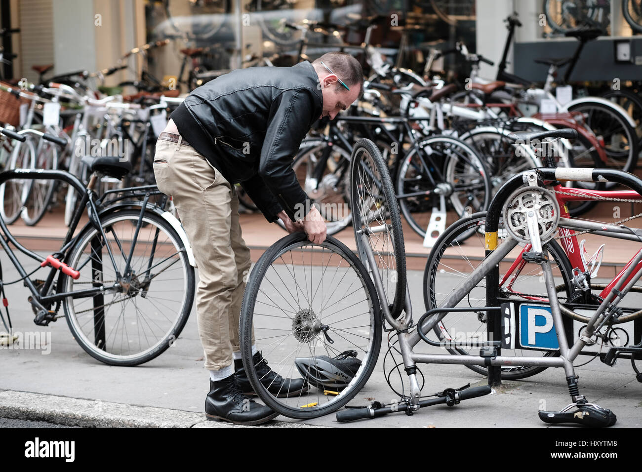 Repairing cycle hi-res stock photography and images - Alamy