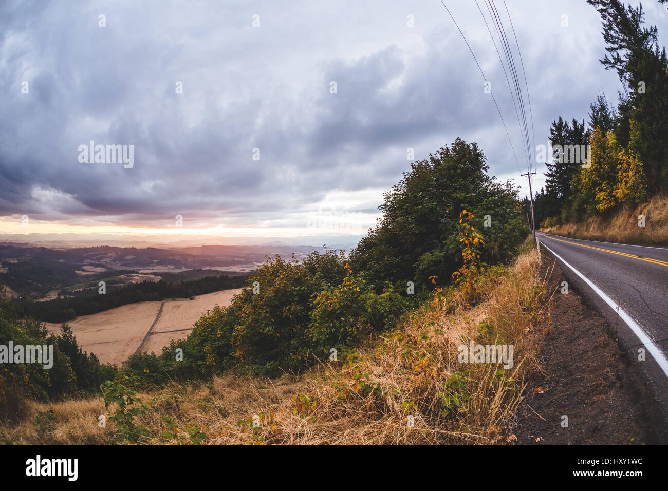 Beautiful sunset with dramatic storm clouds over rural Oregon ...