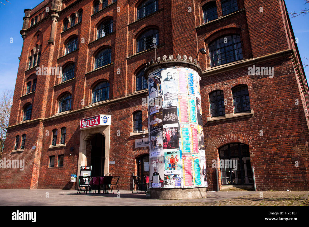 Germany, Cologne, old advertising pillar with event notes in front of ...