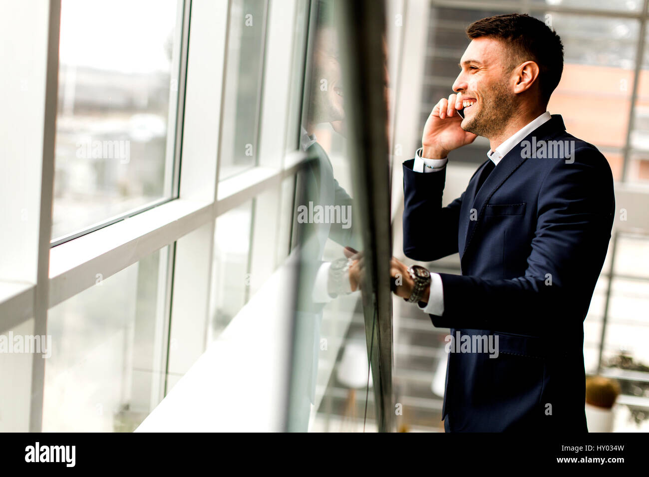 Businessman having phone call in the office Stock Photo - Alamy