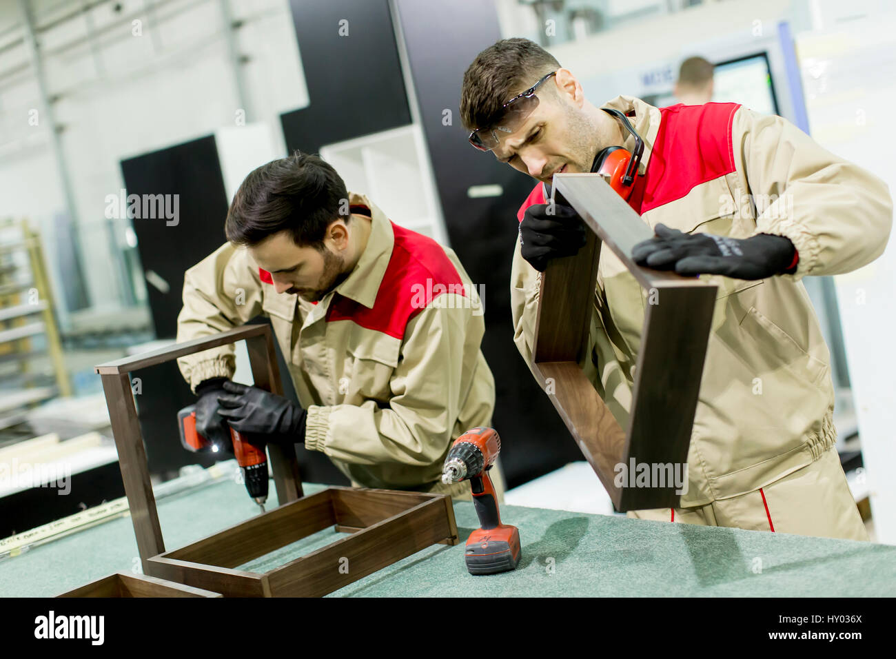 Two men working wood machinery hi-res stock photography and images - Alamy