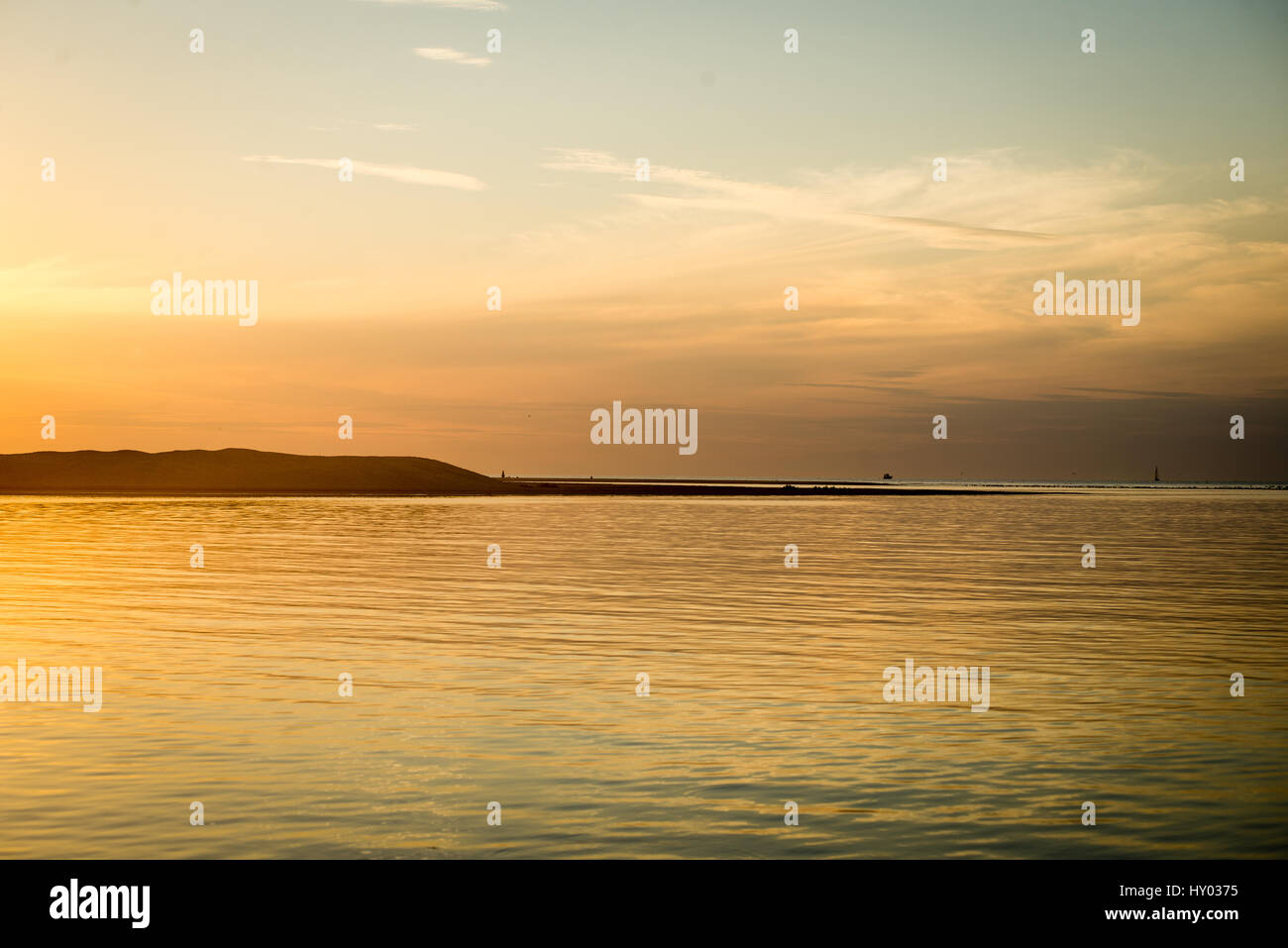 Beautiful summer sunset at the river with blue sky, red and orange ...