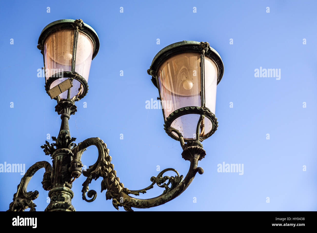 Classic old lamp post isolated on a blue sky background close up Stock ...