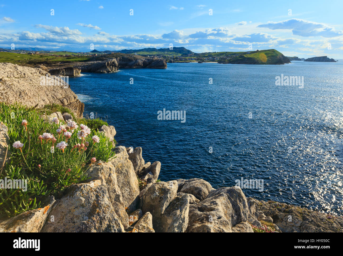Spring evening Atlantic Ocean coastline landscape with sun reflection ...
