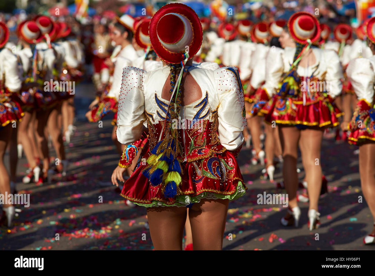 Caporales dance group in ornate red and white costume performing at the ...