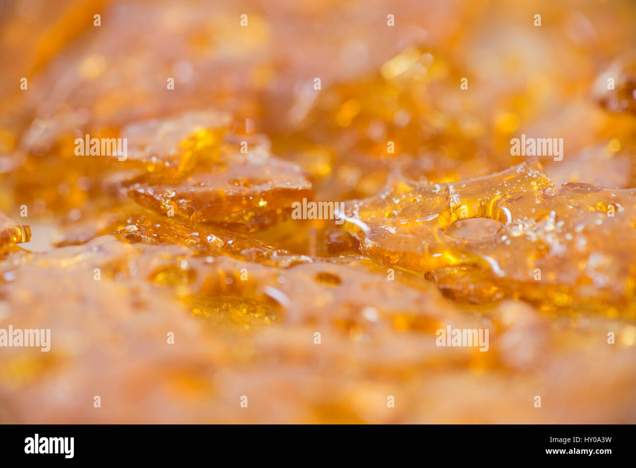 Macro detail of cannabis oil concentrate aka shatter used by medical ...