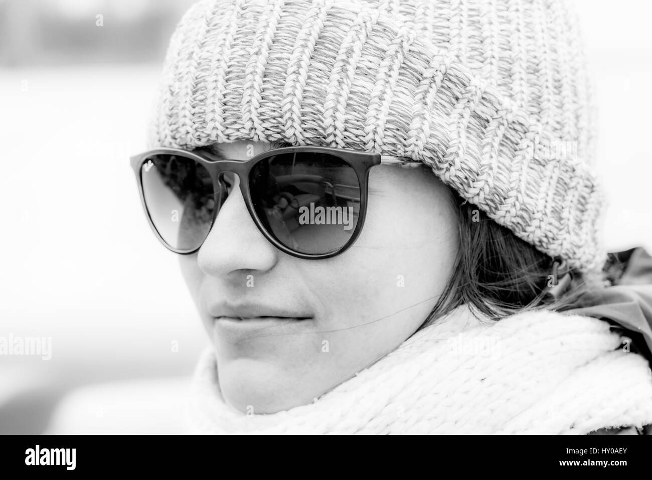 A woman wearing ray-ban sunglasses and a winter cap Stock Photo - Alamy