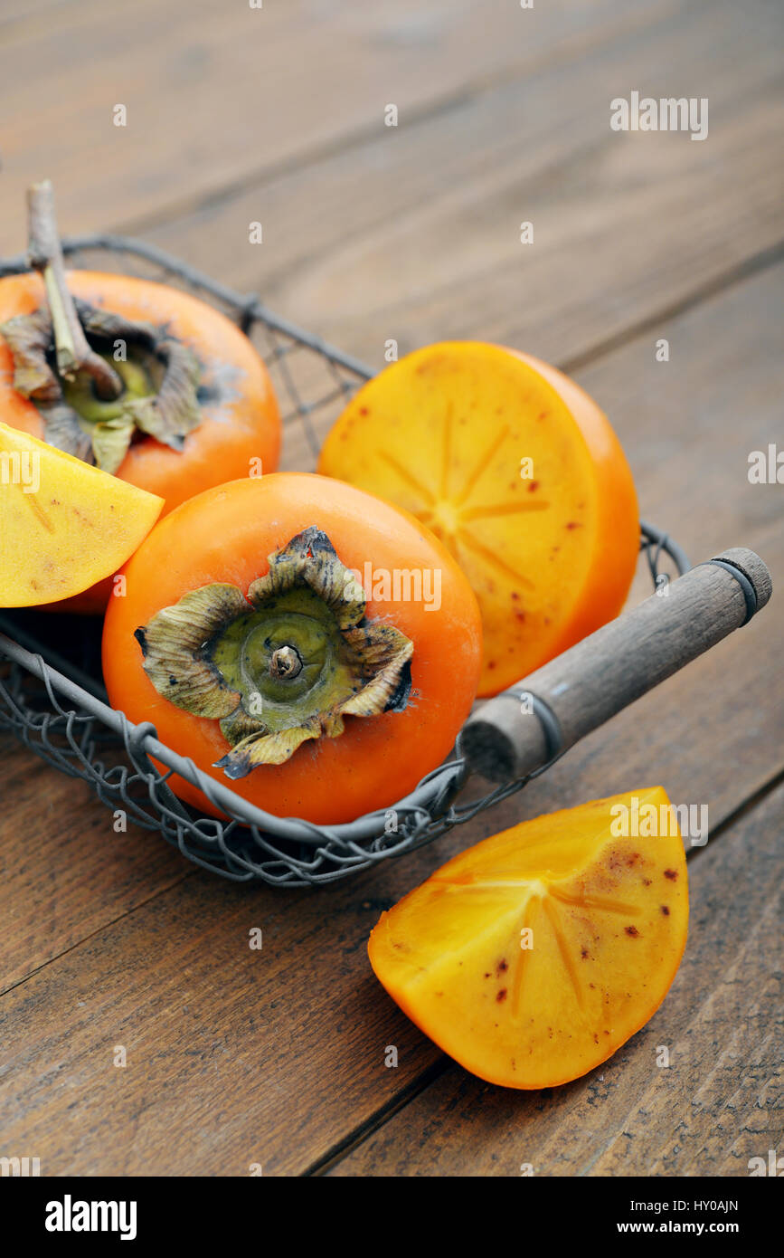 Basket of persimmons hi-res stock photography and images - Alamy