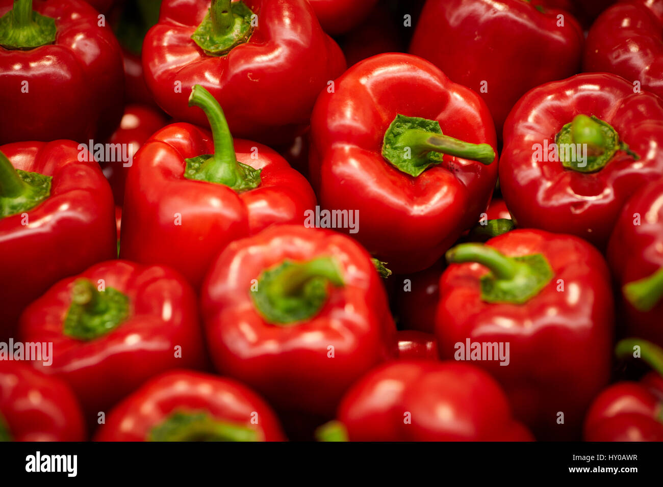 Red pepper vegetables, on display in store Stock Photo - Alamy