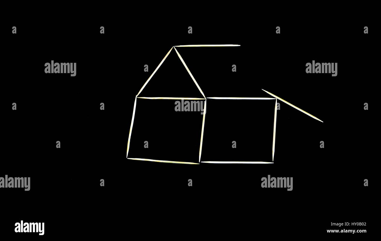 Make a house by toothsticks on black background Stock Photo - Alamy