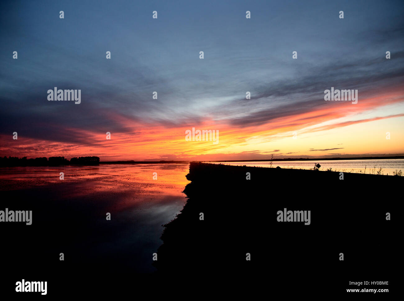 Prairie Sunset lake and road in Canada Stock Photo - Alamy