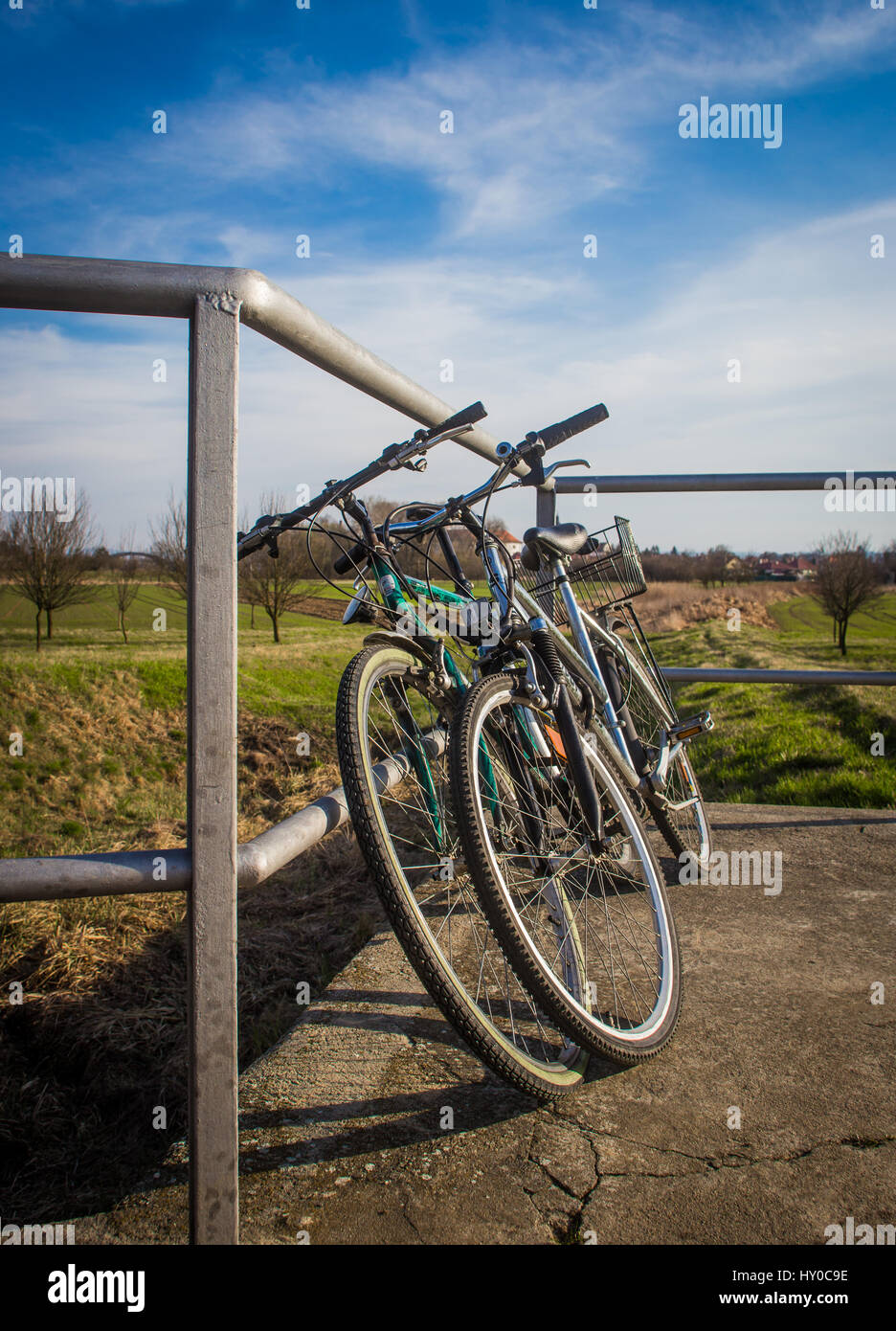 Two bikes parked bike stand hi-res stock photography and images - Alamy