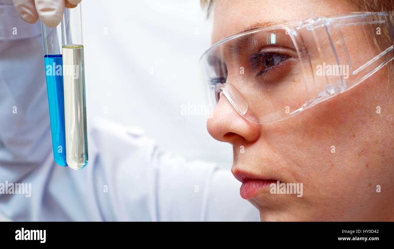 Doctor scientist looking at the test tubes in lab Stock Photo - Alamy
