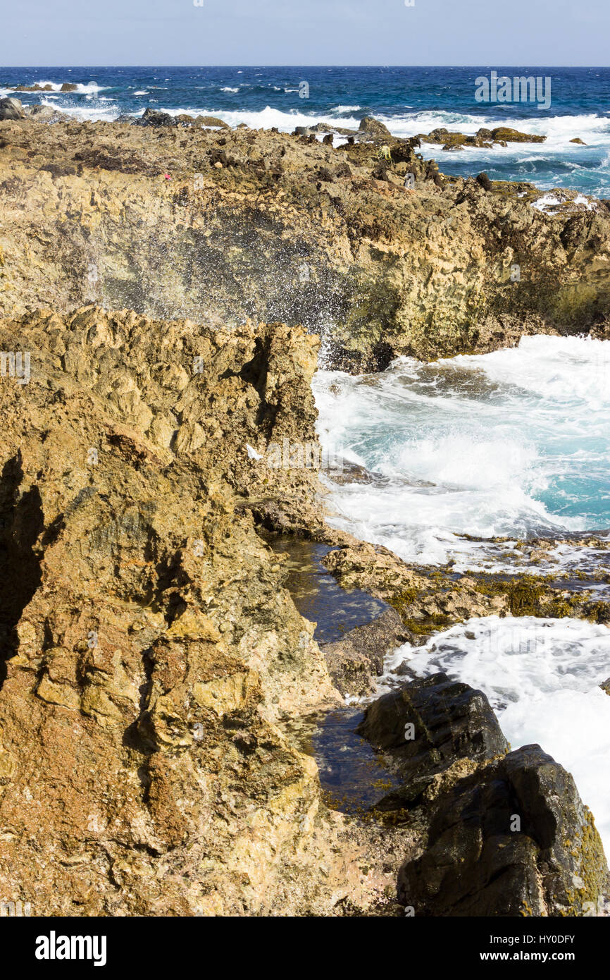 The azure waters of the Caribbean Sea crash onto north shore of Aruba ...