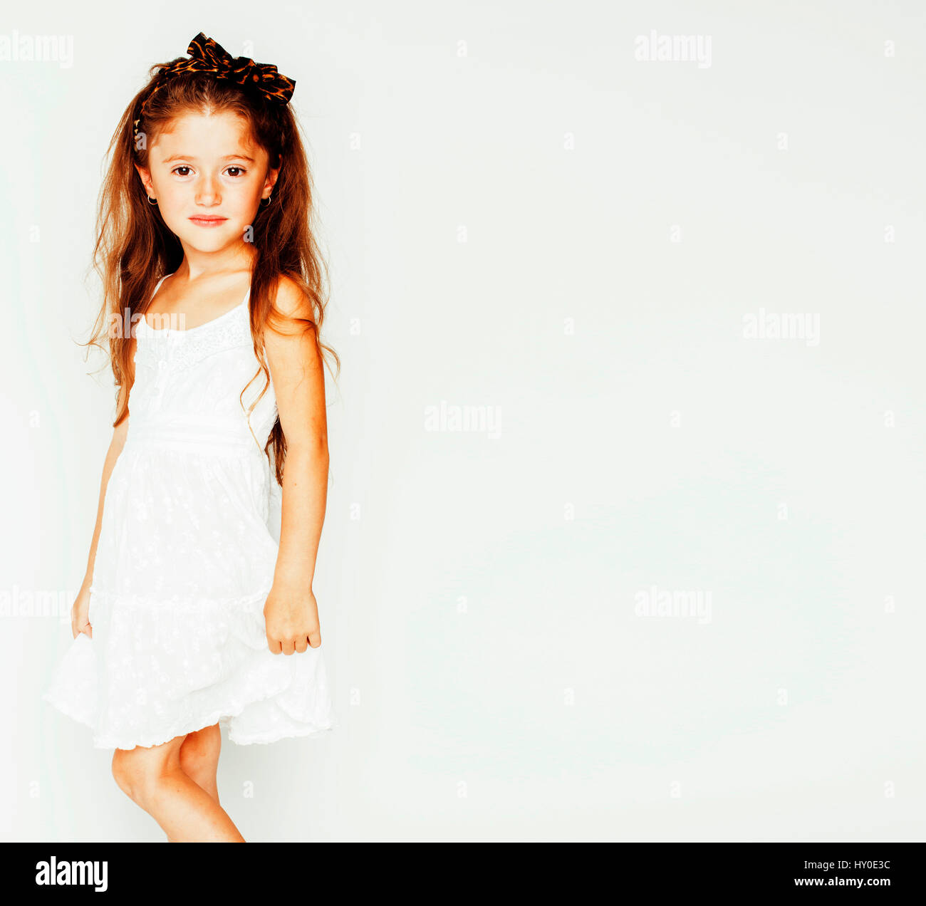 little cute spring girl with lily flower in fancy dress isolated Stock ...