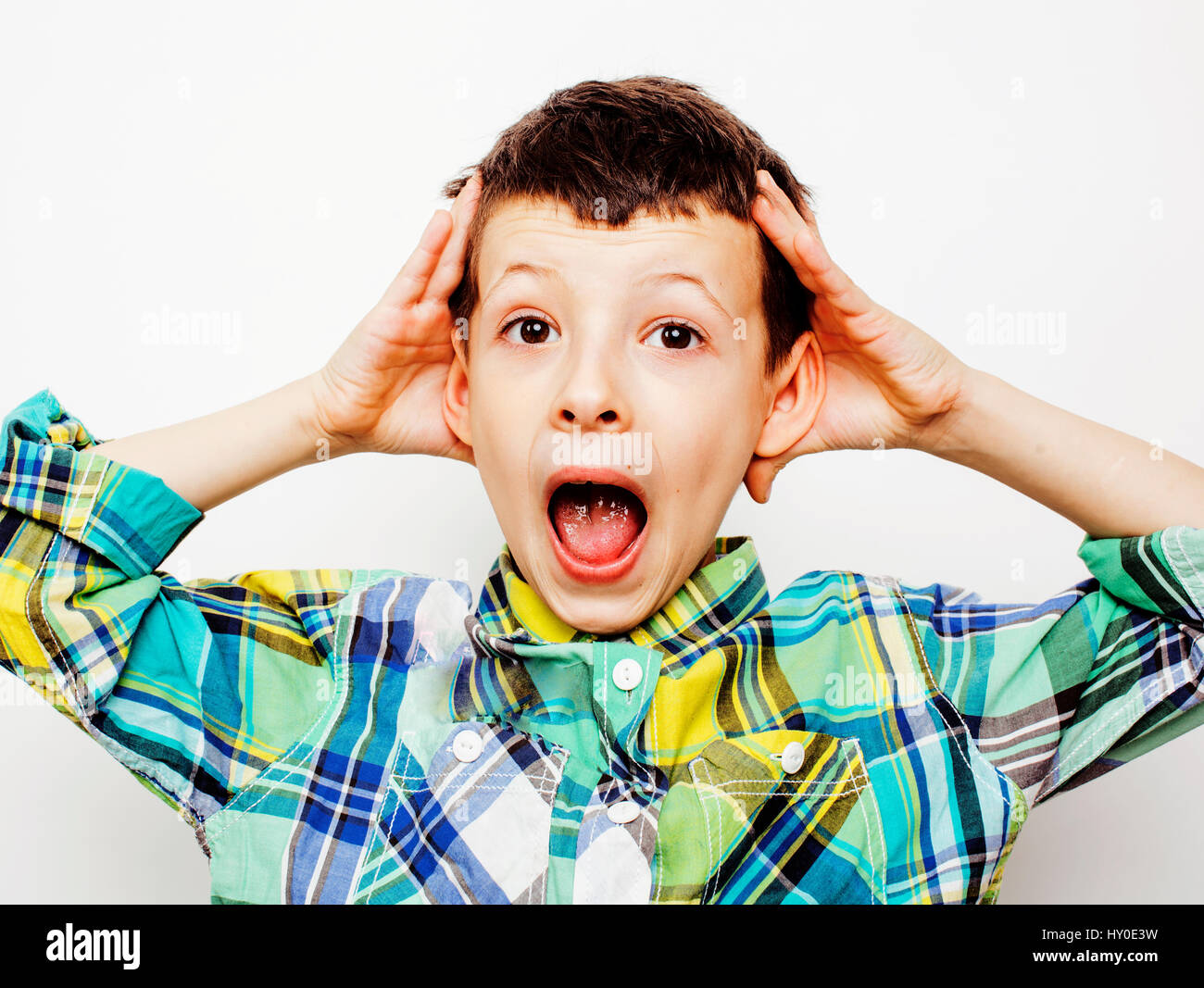 young pretty little cute boy kid wondering, posing emotional face ...