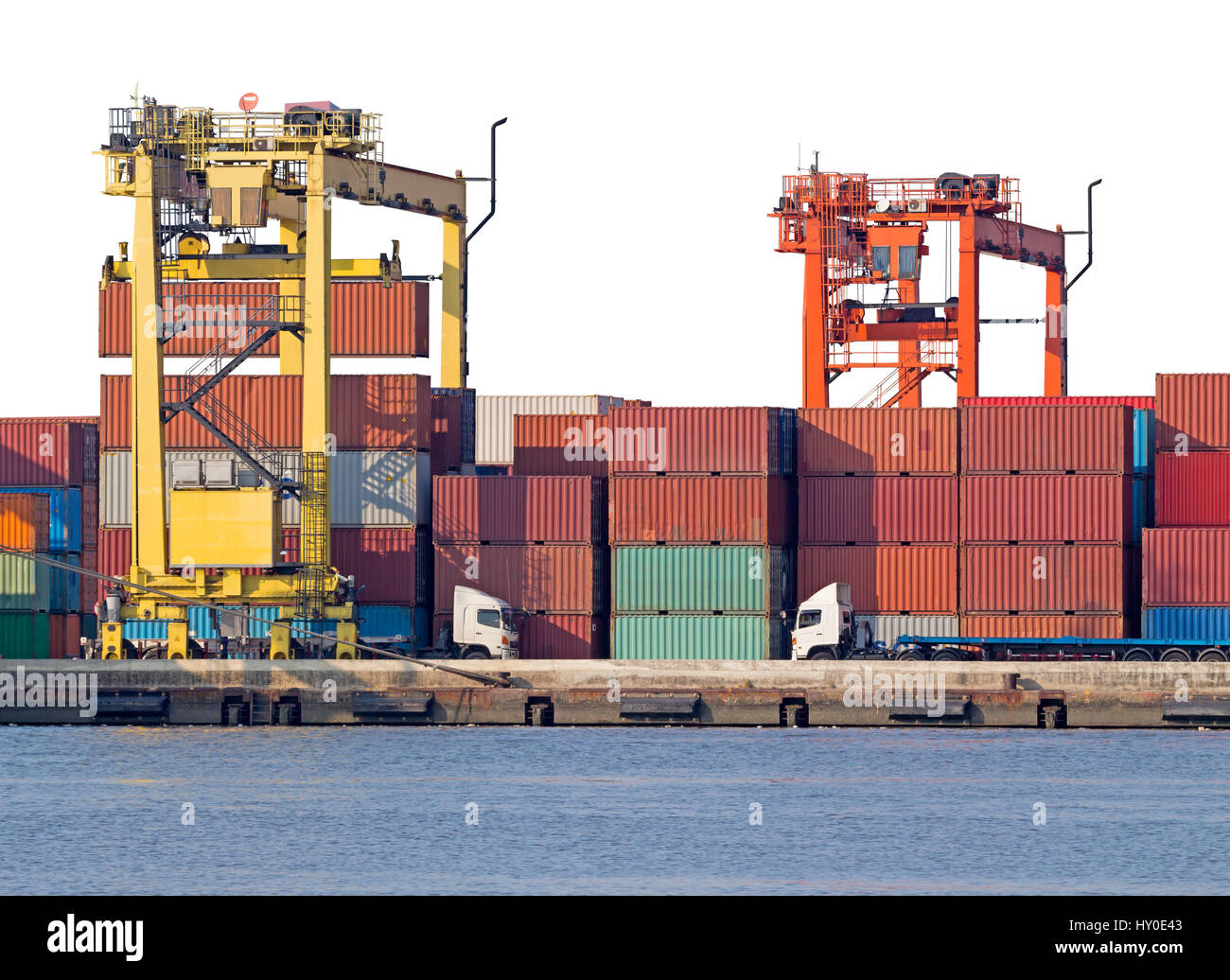 Container cargo freight ship with working crane loading bridge in ...