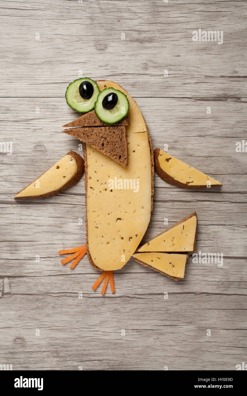 Funny sandwich bird made on wooden background Stock Photo - Alamy