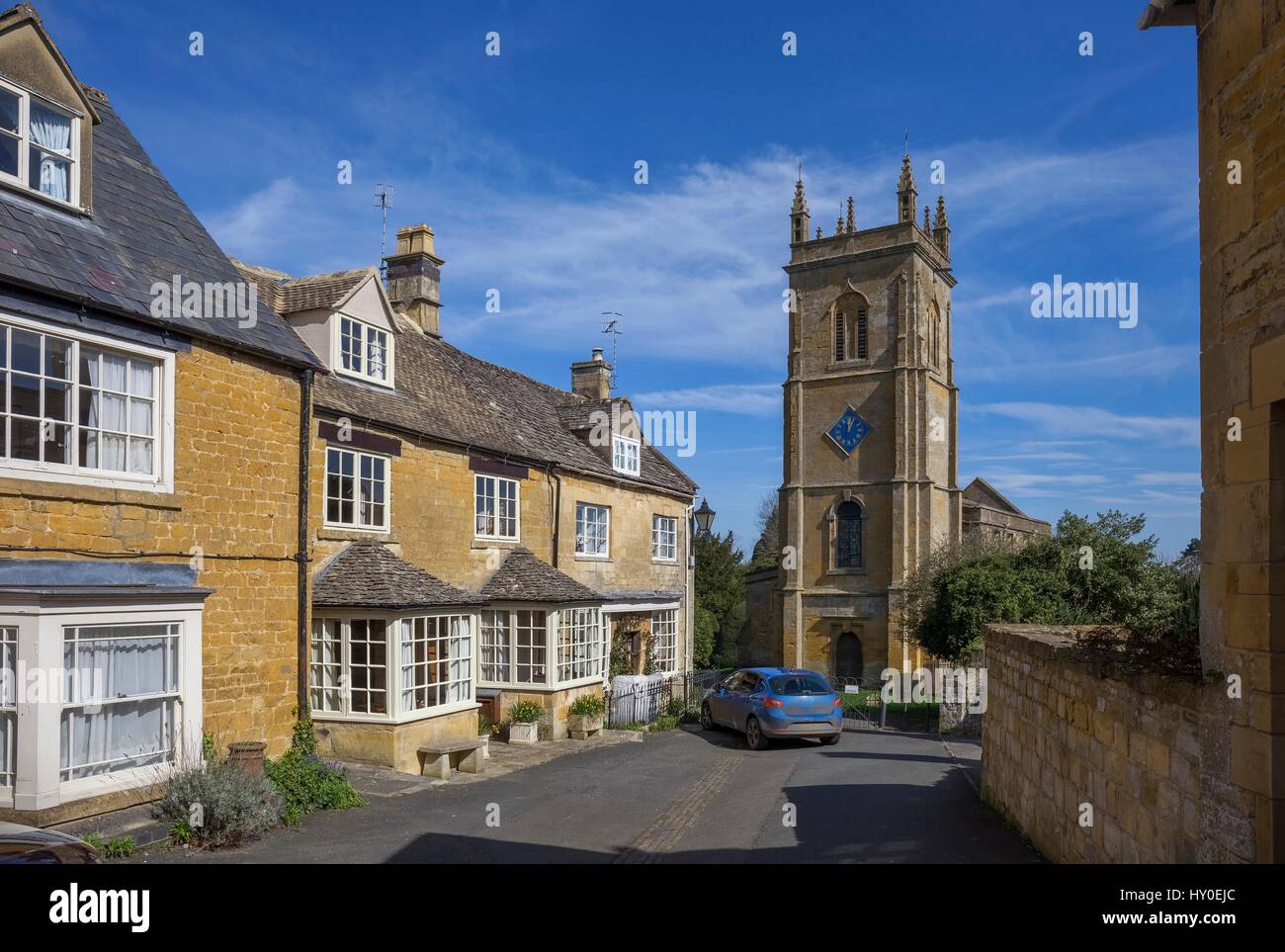 Church and cottages at the Cotswold village of Blockley ...