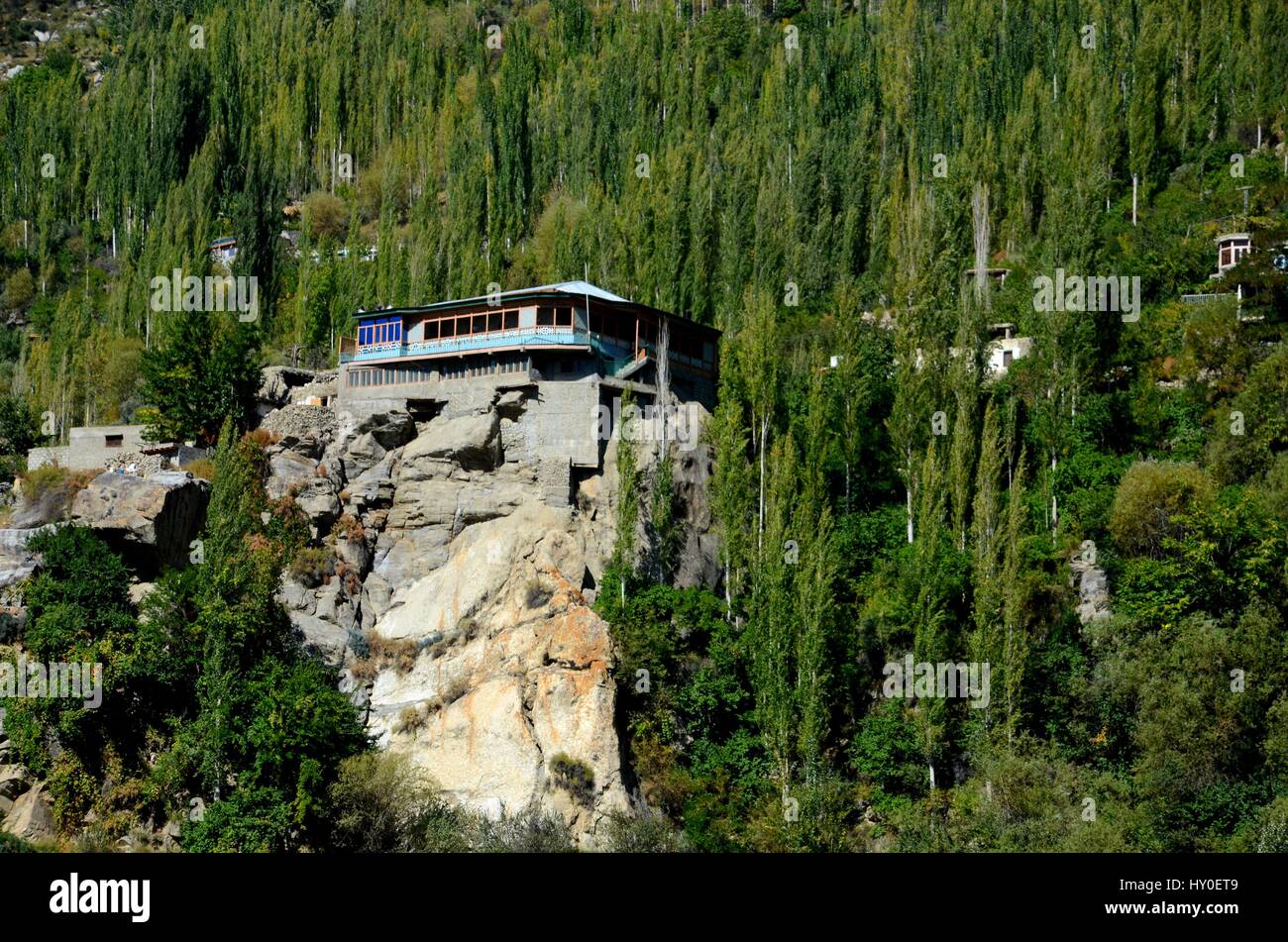 A building stands on top of a rocky ledge in Hunza Valley Pakistan ...