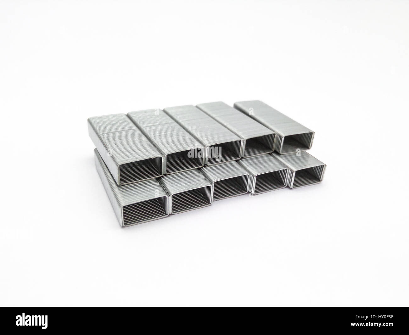 Stack of Many Pieces Staplers on White Background, Isolated Stock Photo ...