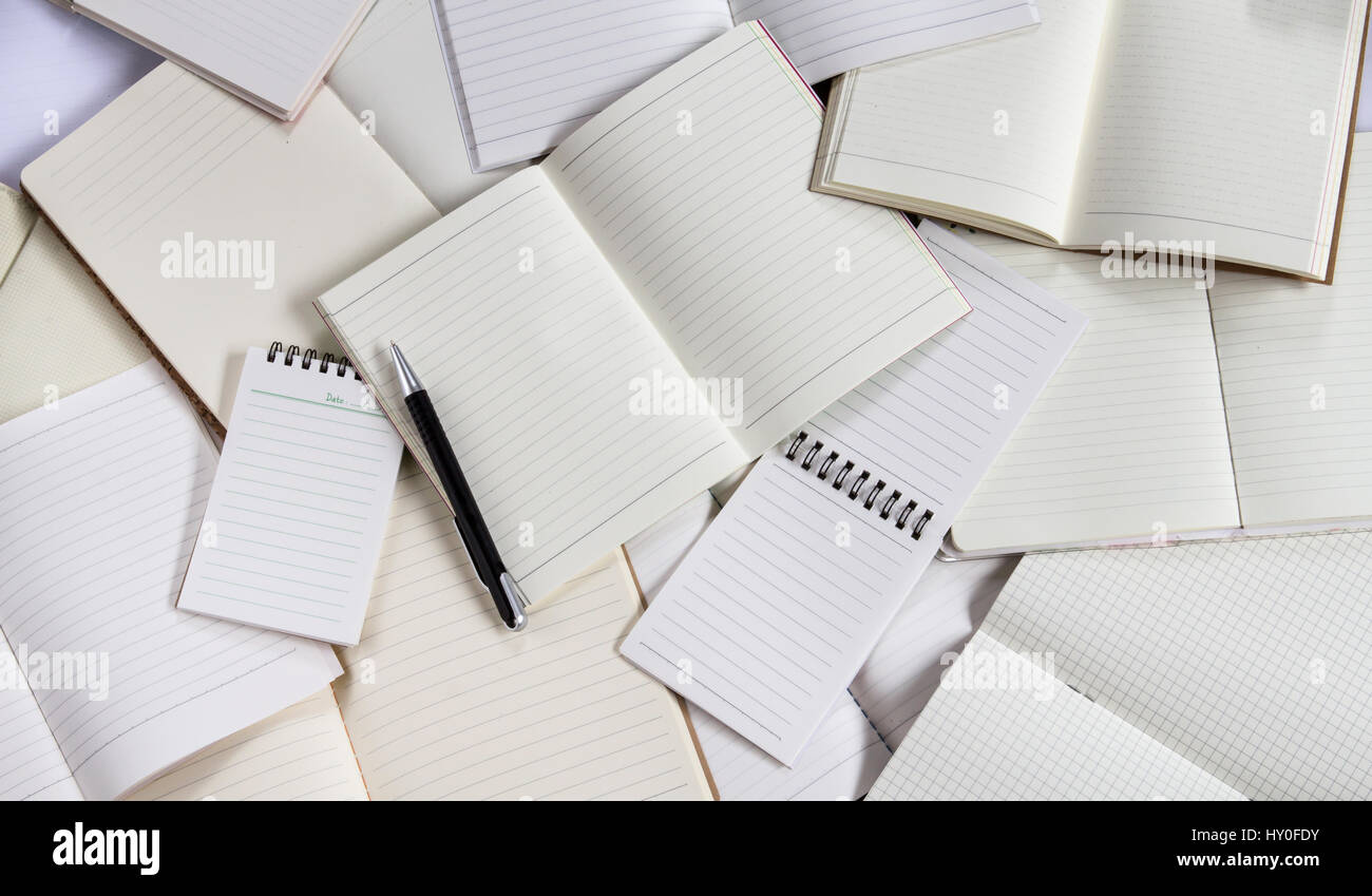Manny empty notebook paper and note pad background Stock Photo - Alamy