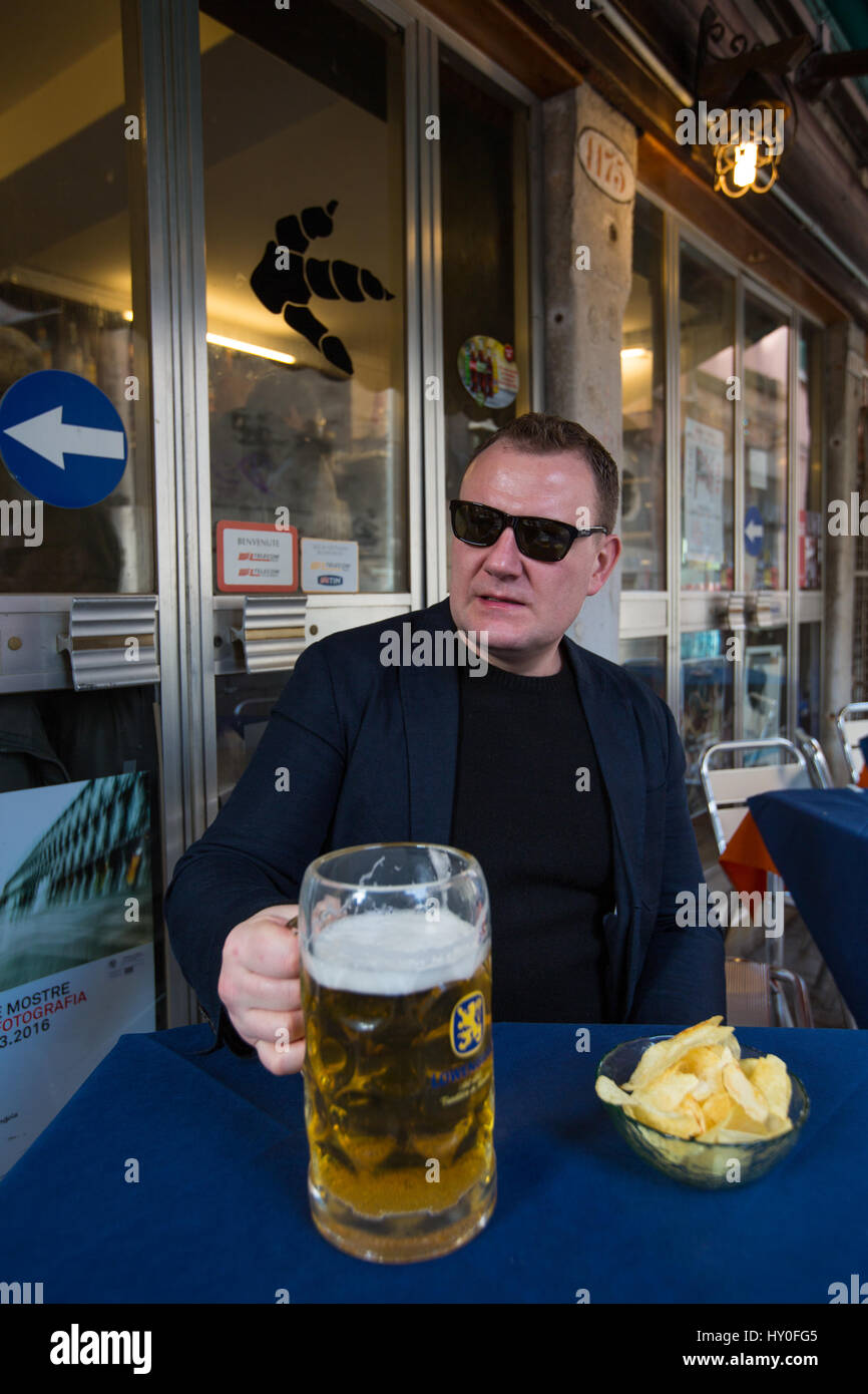 Man drinking a large beer Stock Photo - Alamy