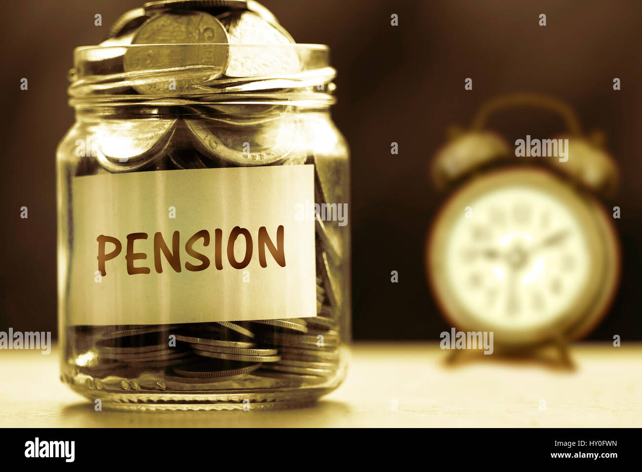 Close up Coins in glass jar for giving and pension concept , dark retro ...