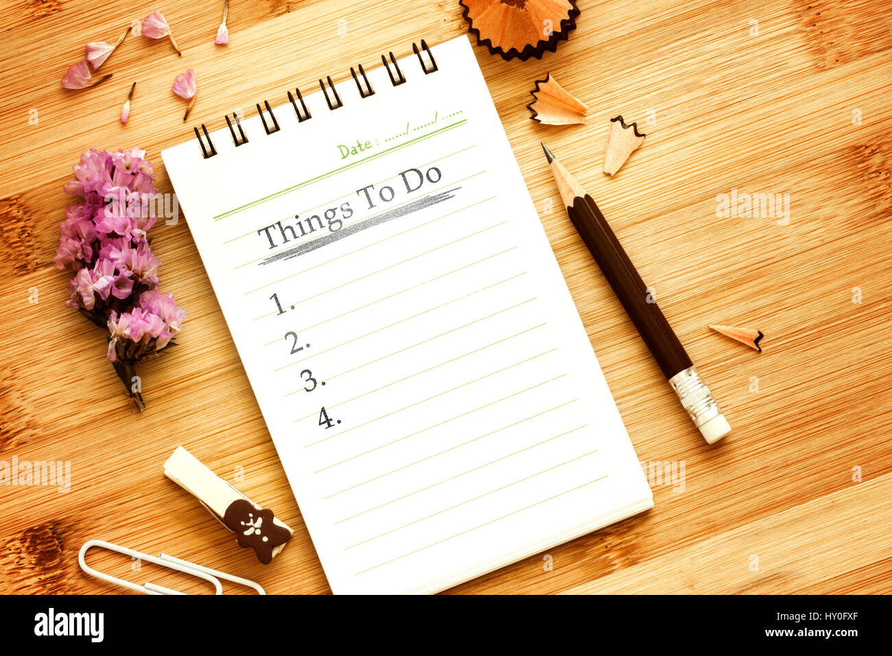 notepad with pencil on wooden table for things to do list concept ...