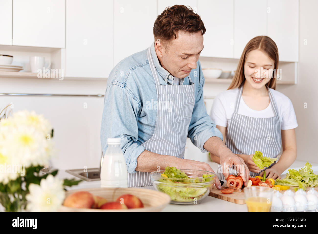 Happy delighted family standing table hi-res stock photography and ...