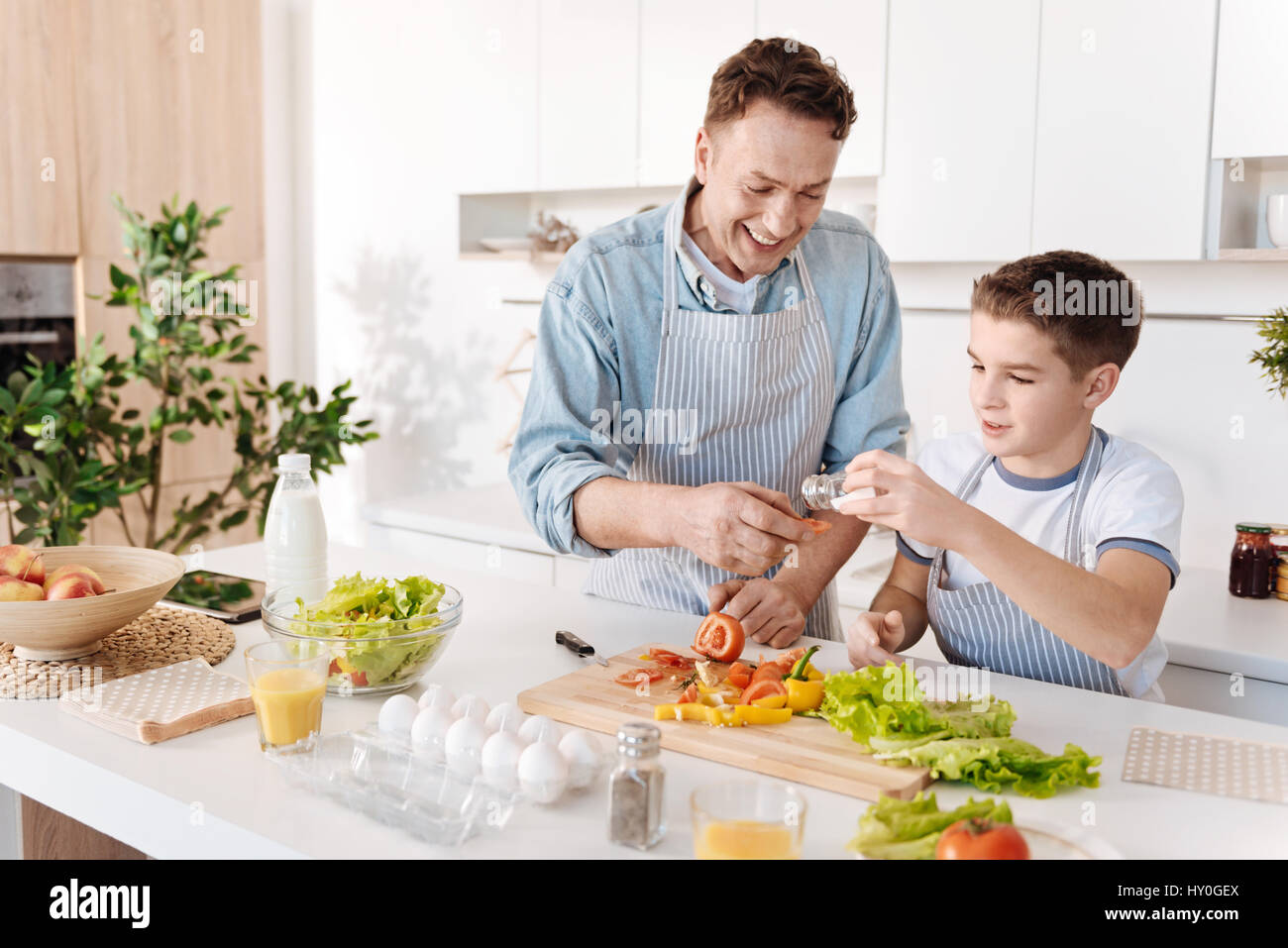 Father son cooking tablet hi-res stock photography and images - Alamy
