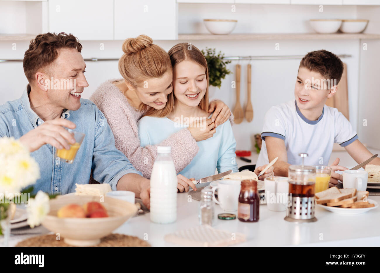My dear daughter. Cheerful delighted loving mother embracing her ...