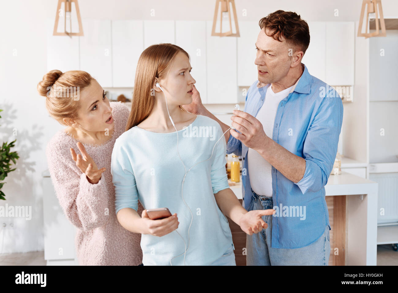 Strict father scolding his daughter Stock Photo - Alamy