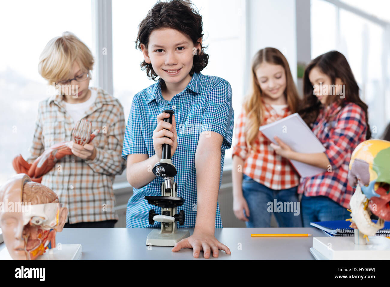 Excited good looking kid working with lab equipment Stock Photo - Alamy