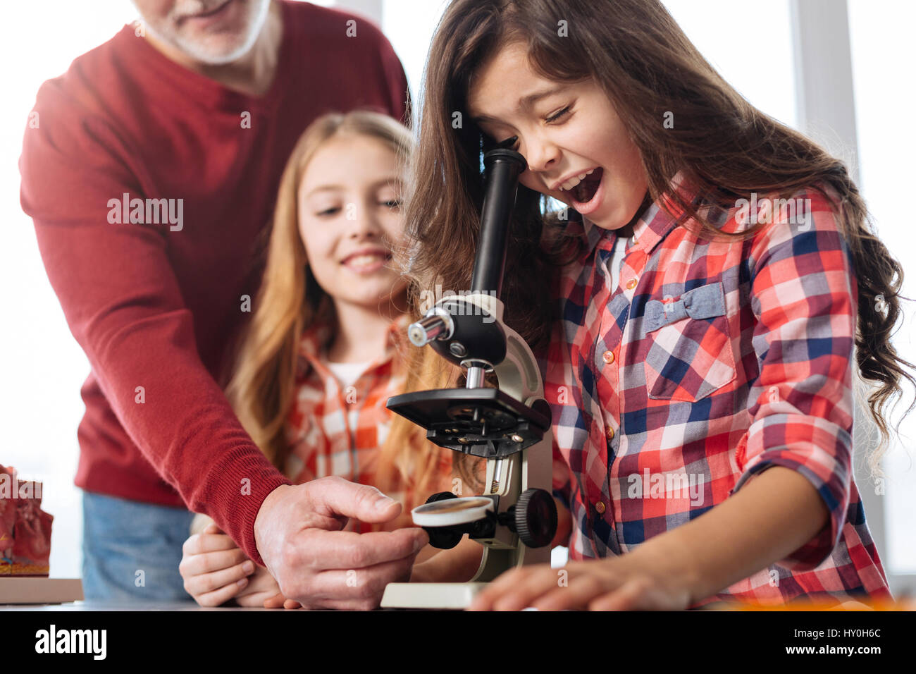 Amazed cute child observing microscopic particles Stock Photo - Alamy