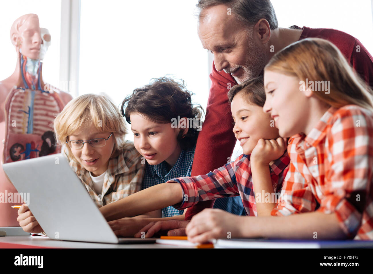 Active persistent students watching videos in class Stock Photo - Alamy